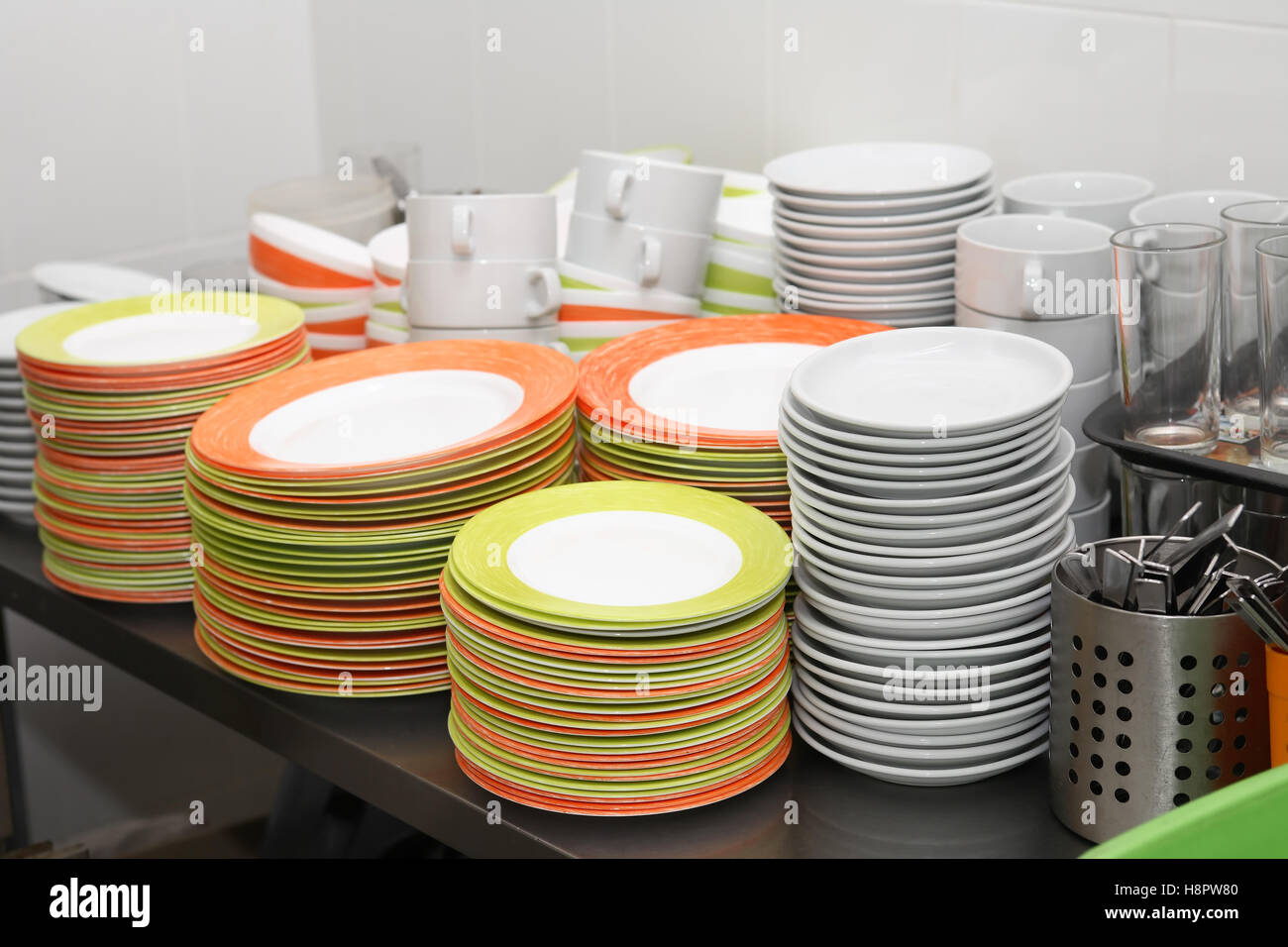 Crockery washing. Set of various clean dishware on table in kitchen ...