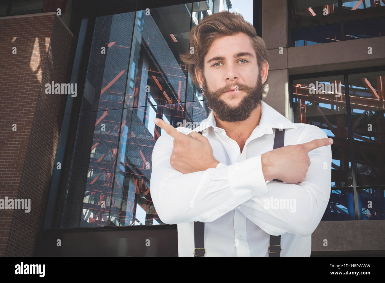 Composite image of confident hipster pointing sideways with arms ...