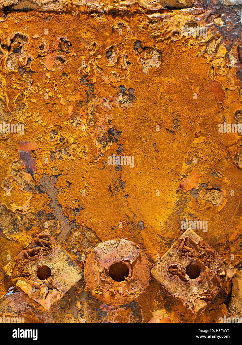 Three rusty steel parts on a rusty surface Stock Photo - Alamy