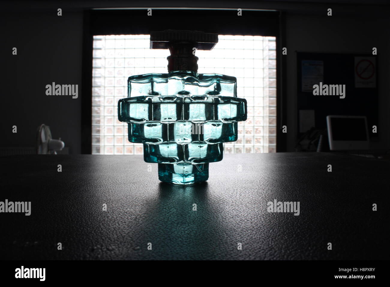 Blue glass perfume bottle Stock Photo - Alamy