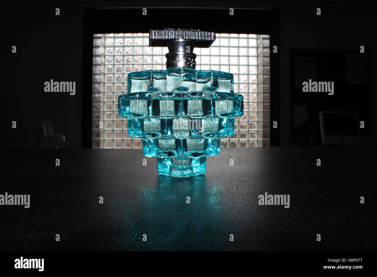 Blue glass perfume bottle Stock Photo - Alamy