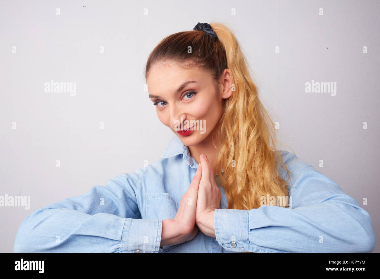 beautiful smiling woman in the studio Stock Photo - Alamy
