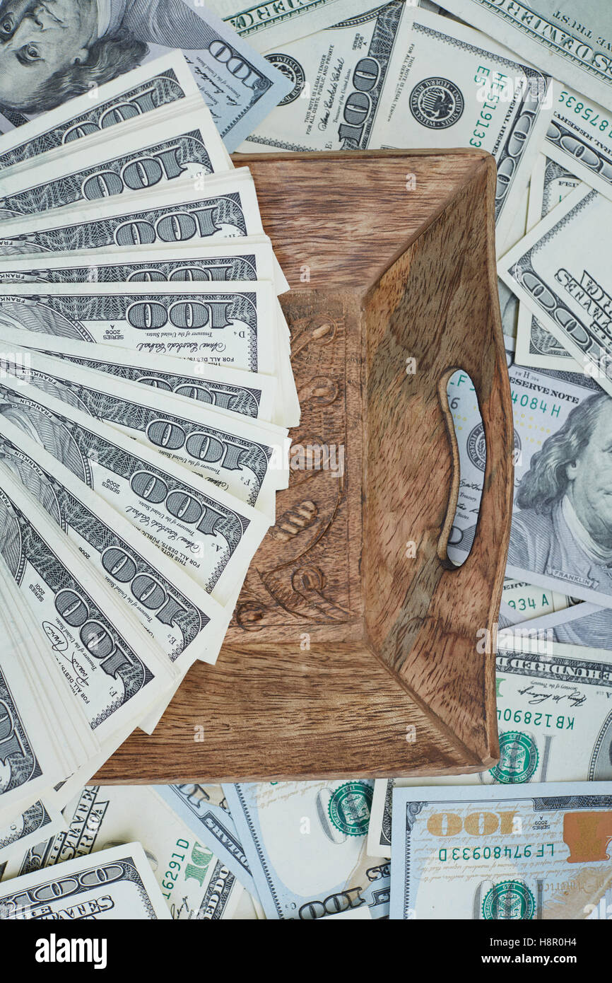 Money on a tray Stock Photo - Alamy