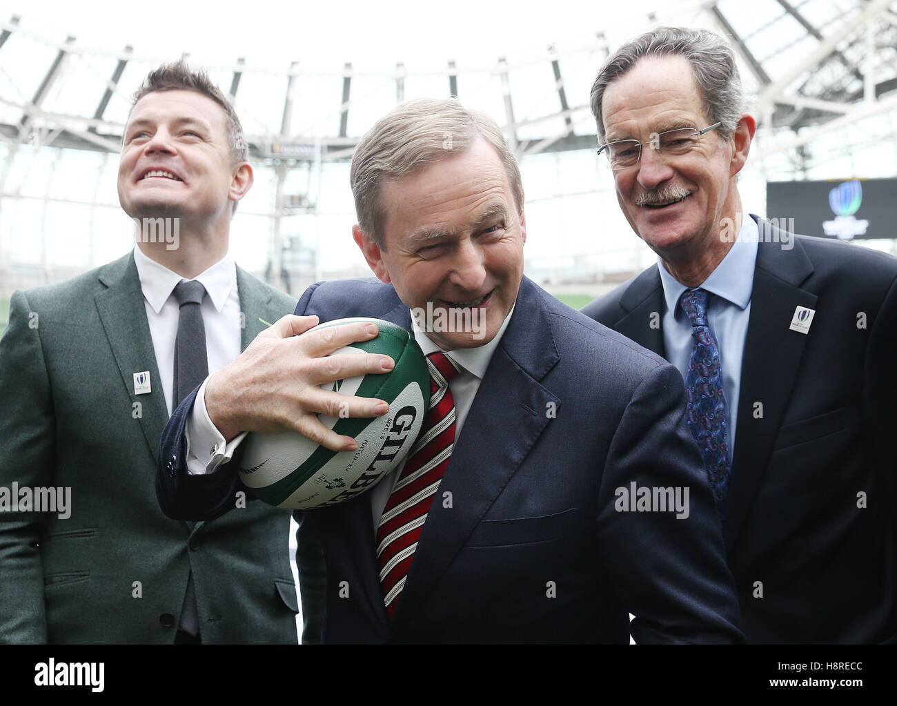 Taoiseach Enda Kenny (centre) with former Ireland international Brian O ...