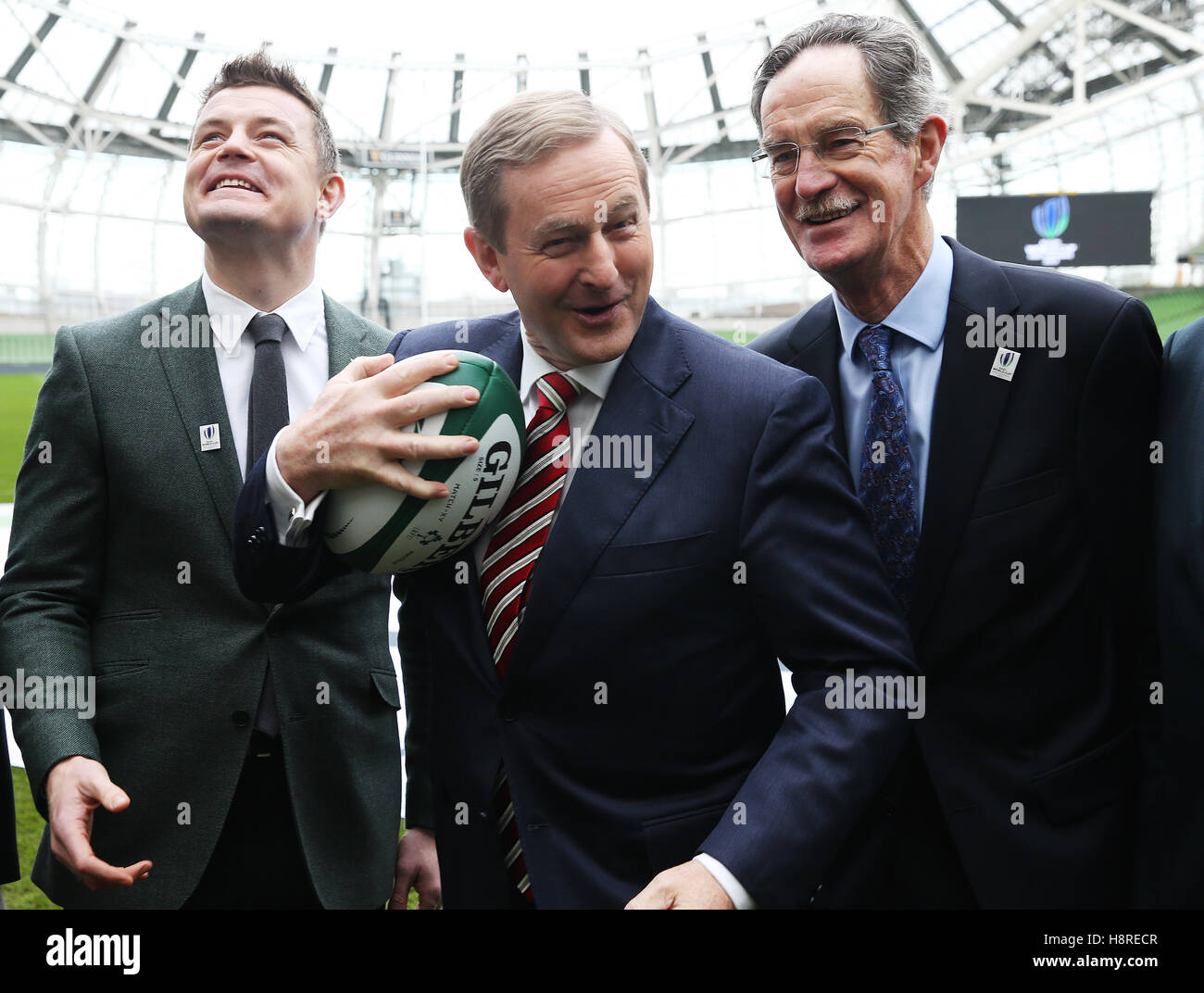 Taoiseach Enda Kenny (centre) with former Ireland international Brian O ...