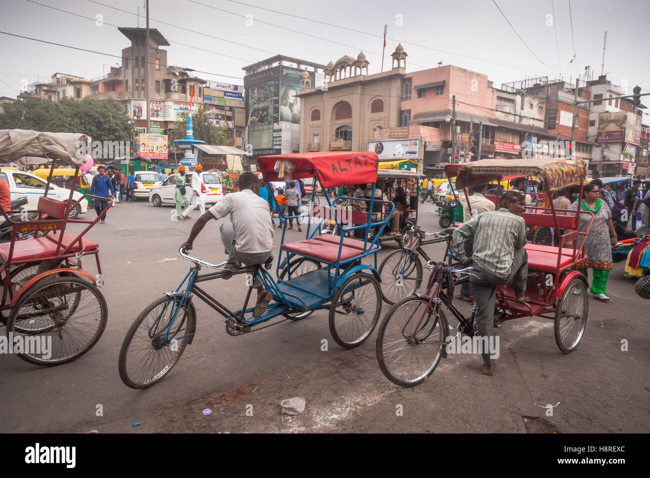 Cycle rickshaw drivers waiting for custom in a street in Old Delhi ...