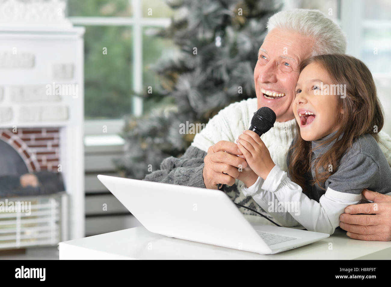 Singing karaoke at home Stock Photo - Alamy