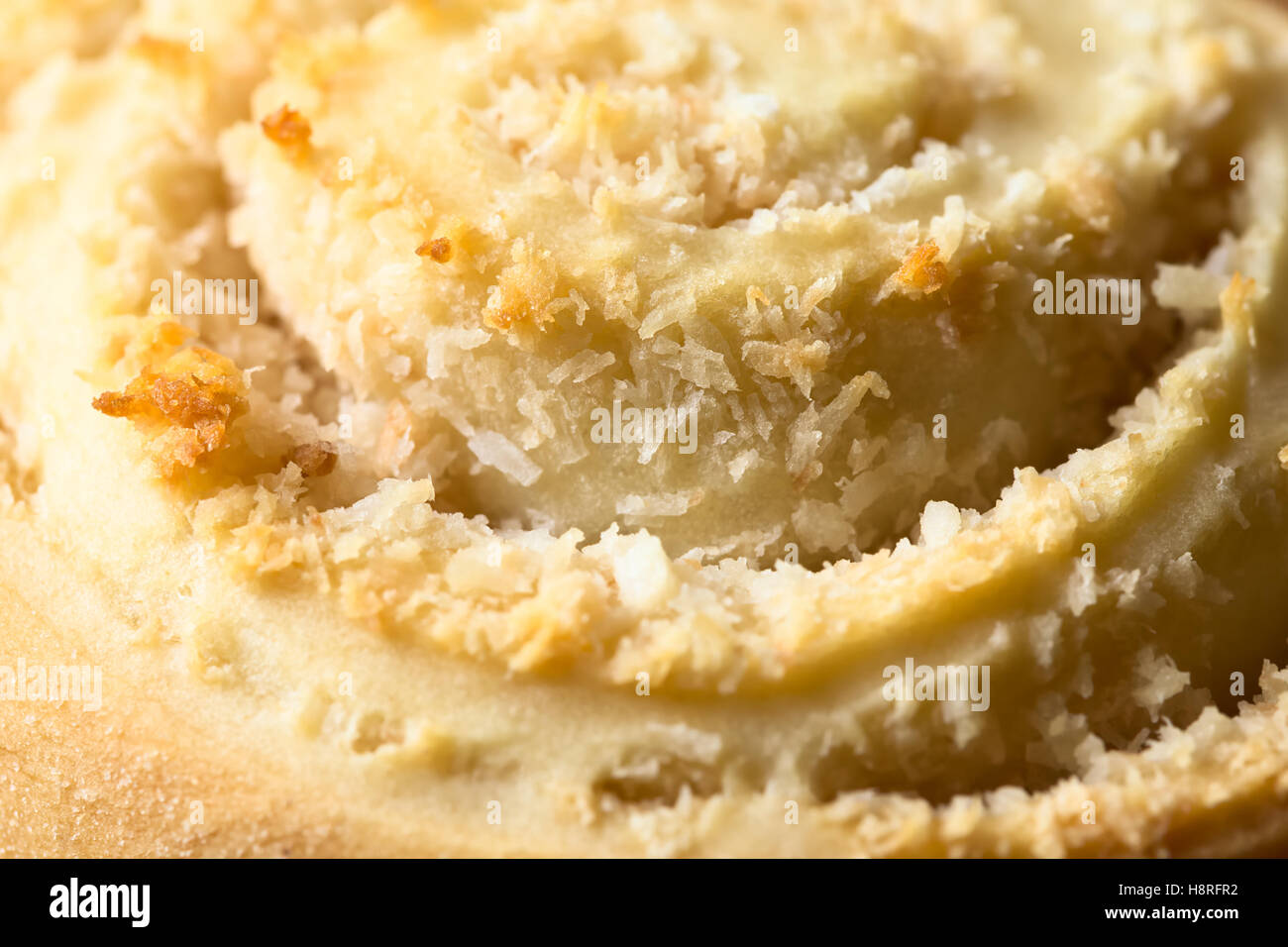 Closeup of freshly baked sweet coconut roll, photographed with natural ...