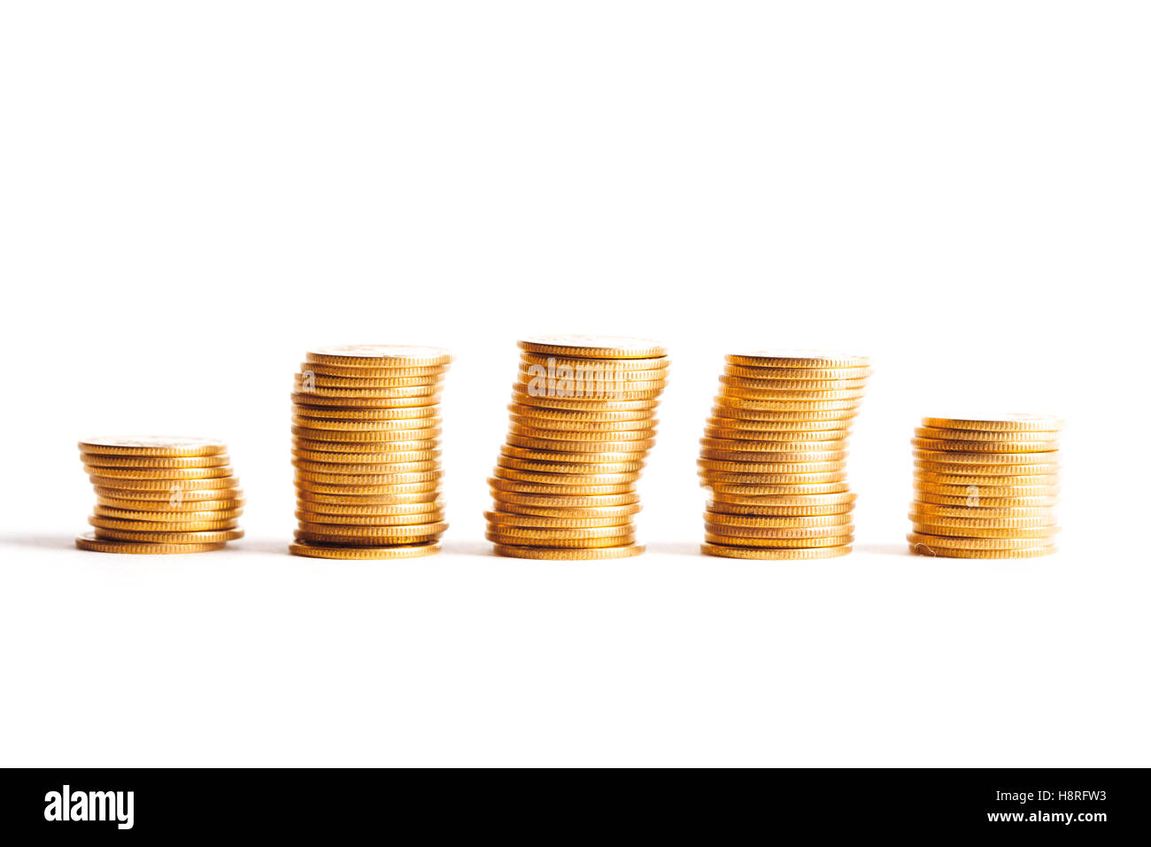 Coin stacks on a white background Stock Photo - Alamy
