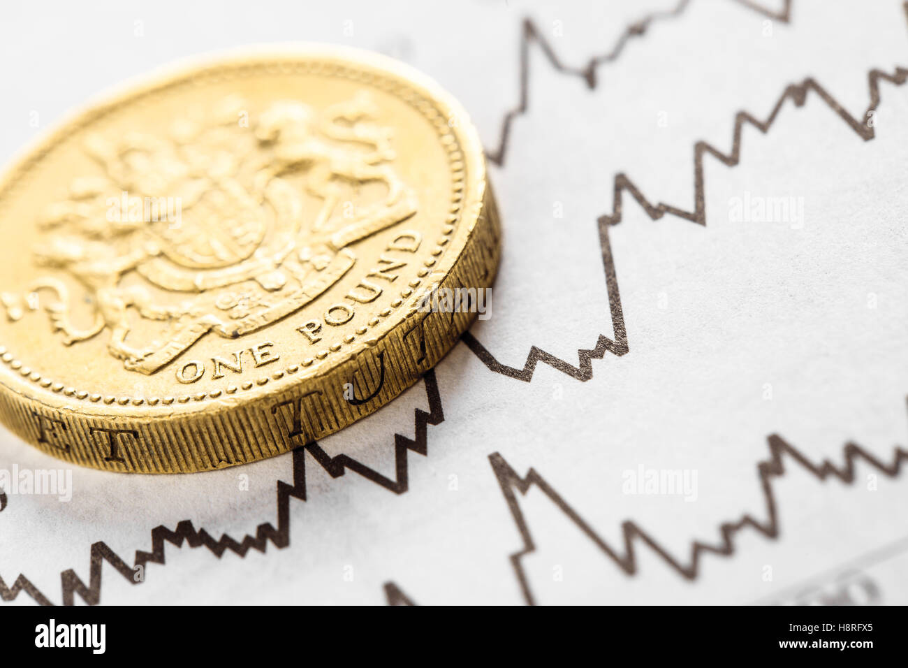 The coin one pound on graphics background Stock Photo - Alamy