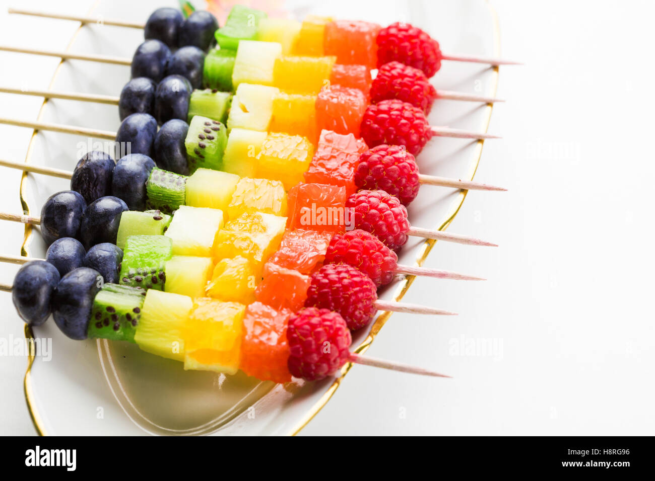 Fresh summer fruits on sticks Stock Photo - Alamy