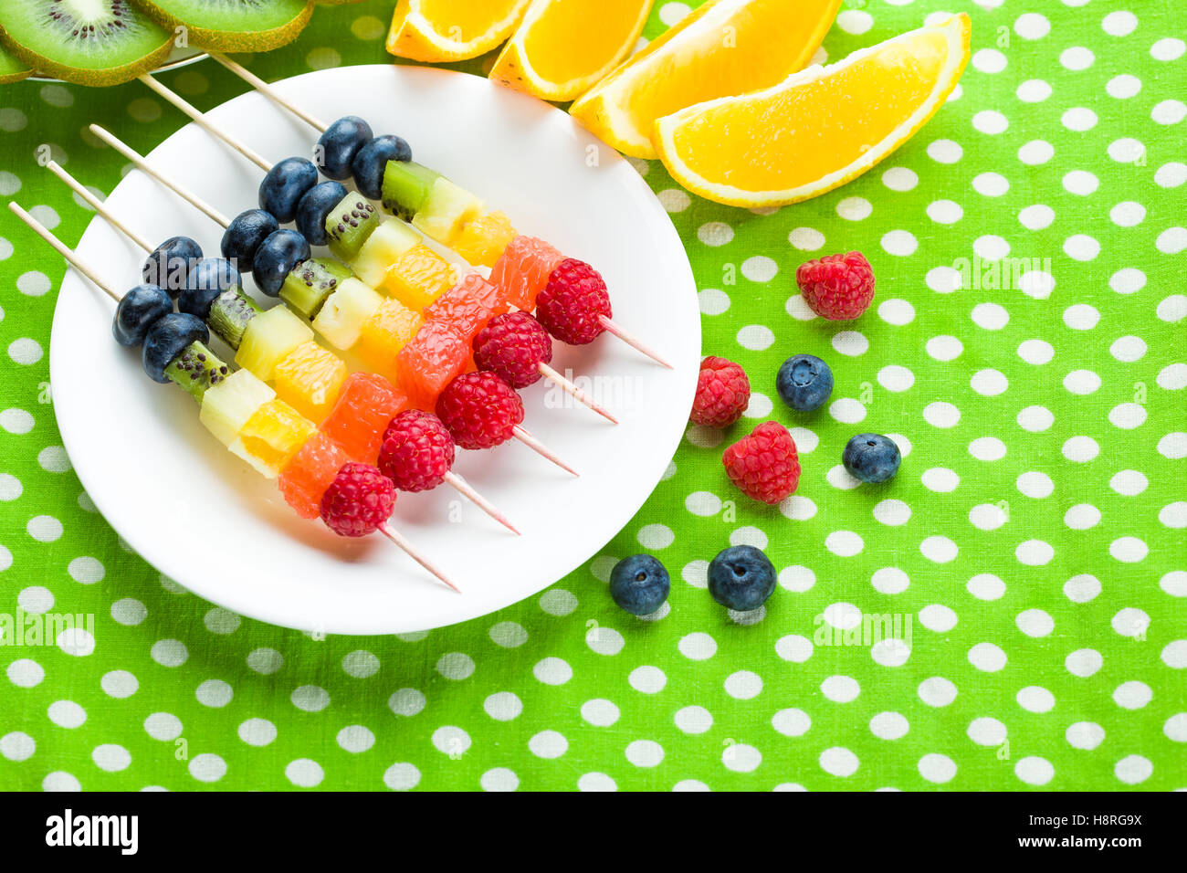Fresh summer fruits on sticks Stock Photo - Alamy