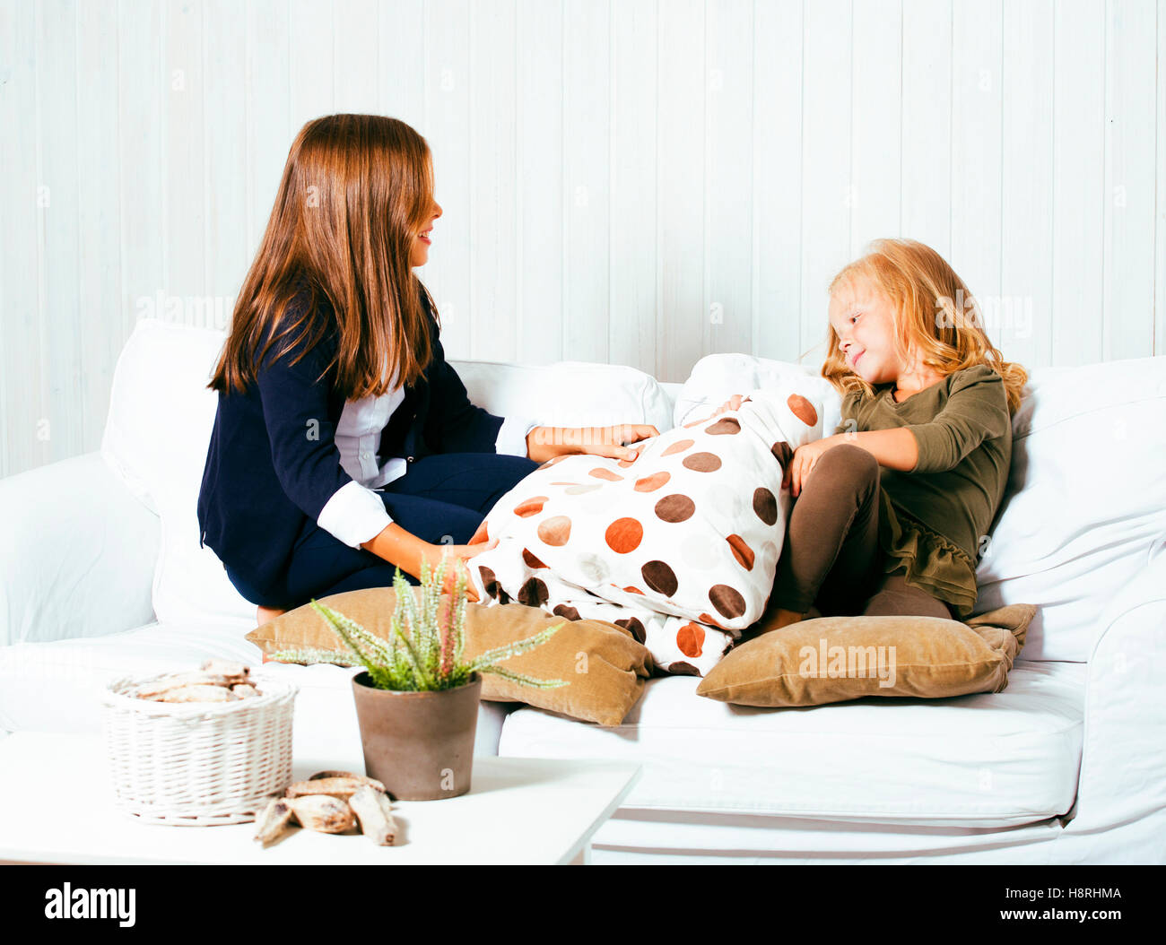 two cute sisters at home playing, little girl in house interior Stock ...