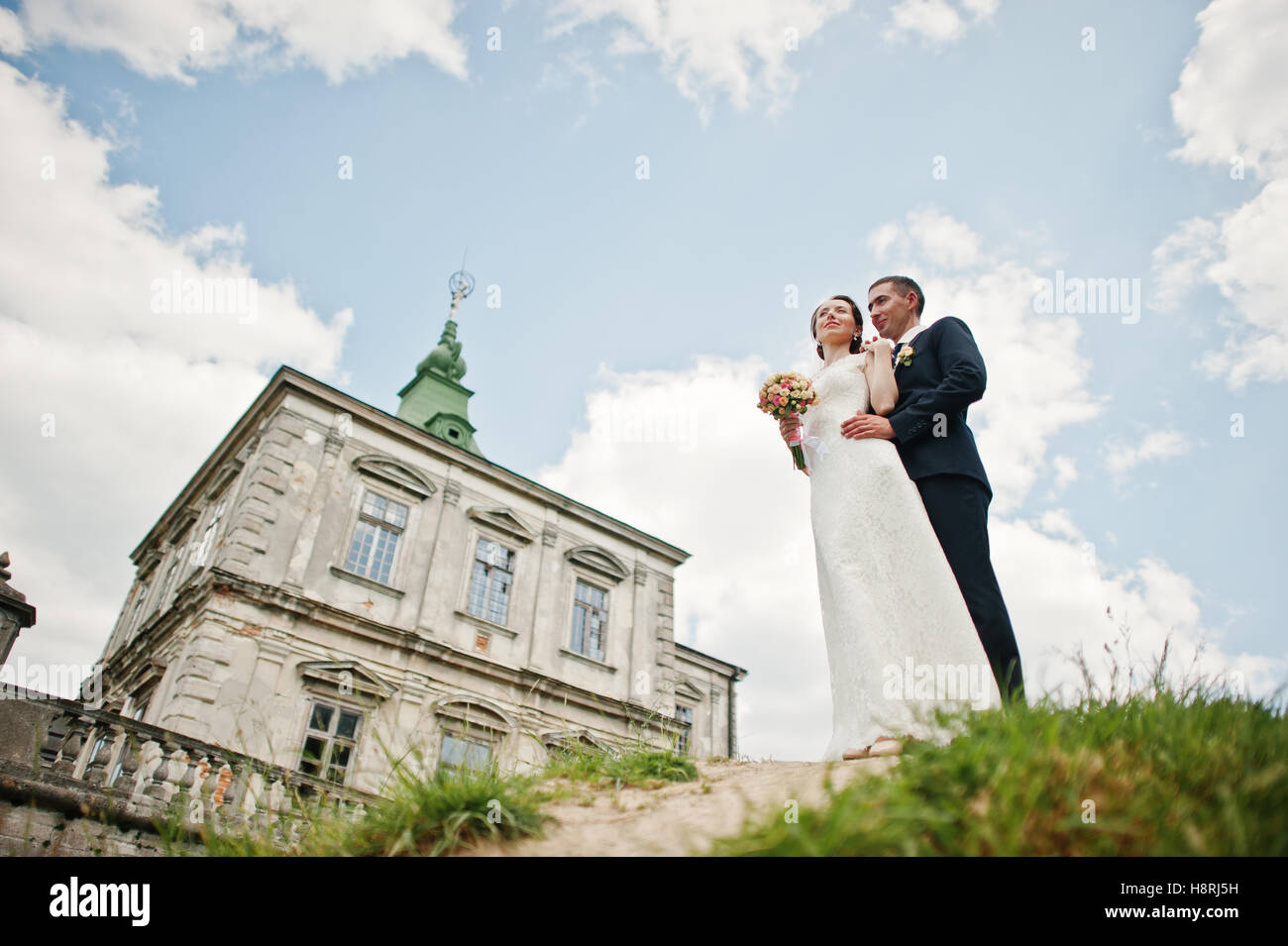 Wedding couple background old vintage castle. Happy newlyweds at their ...