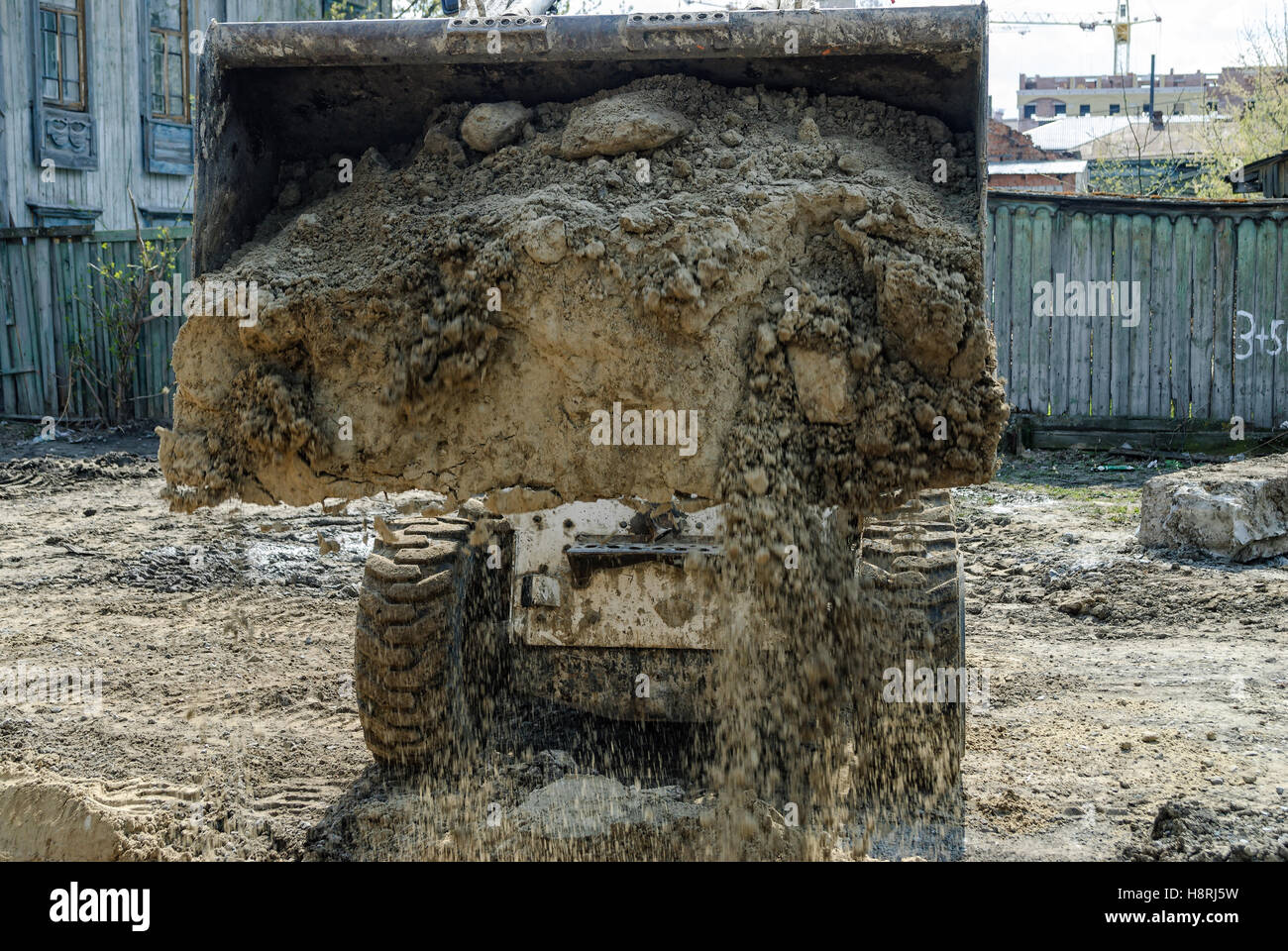 Skid loader on road construction Stock Photo - Alamy