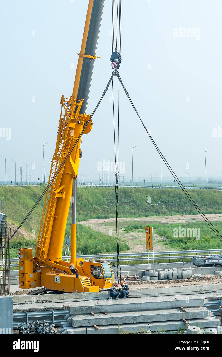 Crane working on bridge construction Stock Photo - Alamy