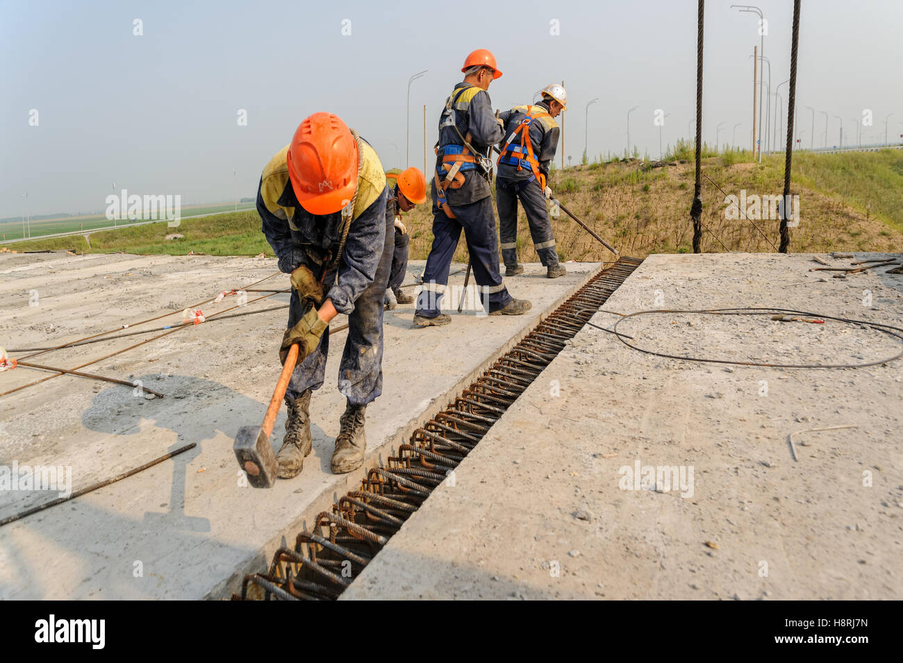 Workers teamwork on road construction Stock Photo - Alamy