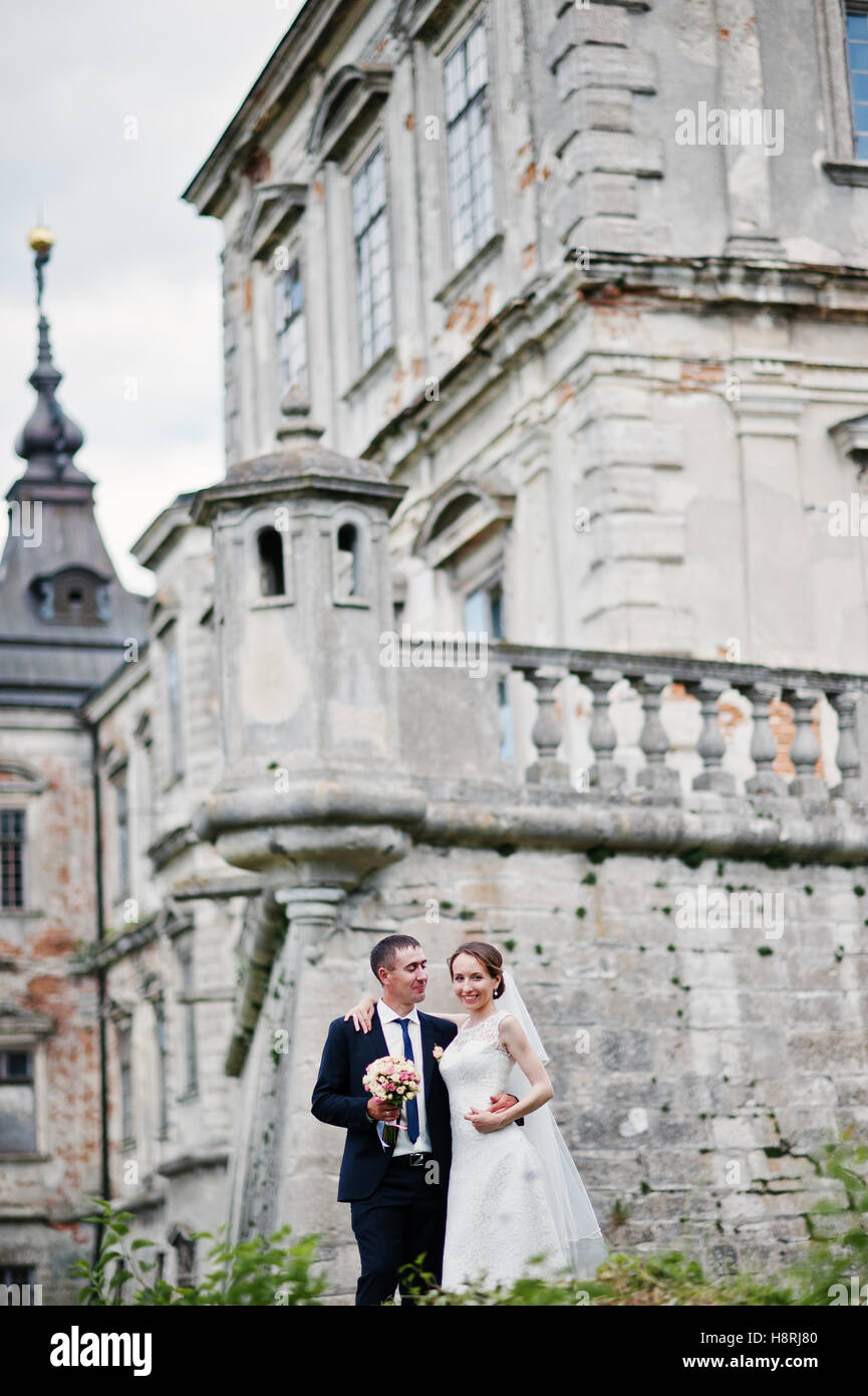 Wedding couple background old vintage castle. Happy newlyweds at their ...