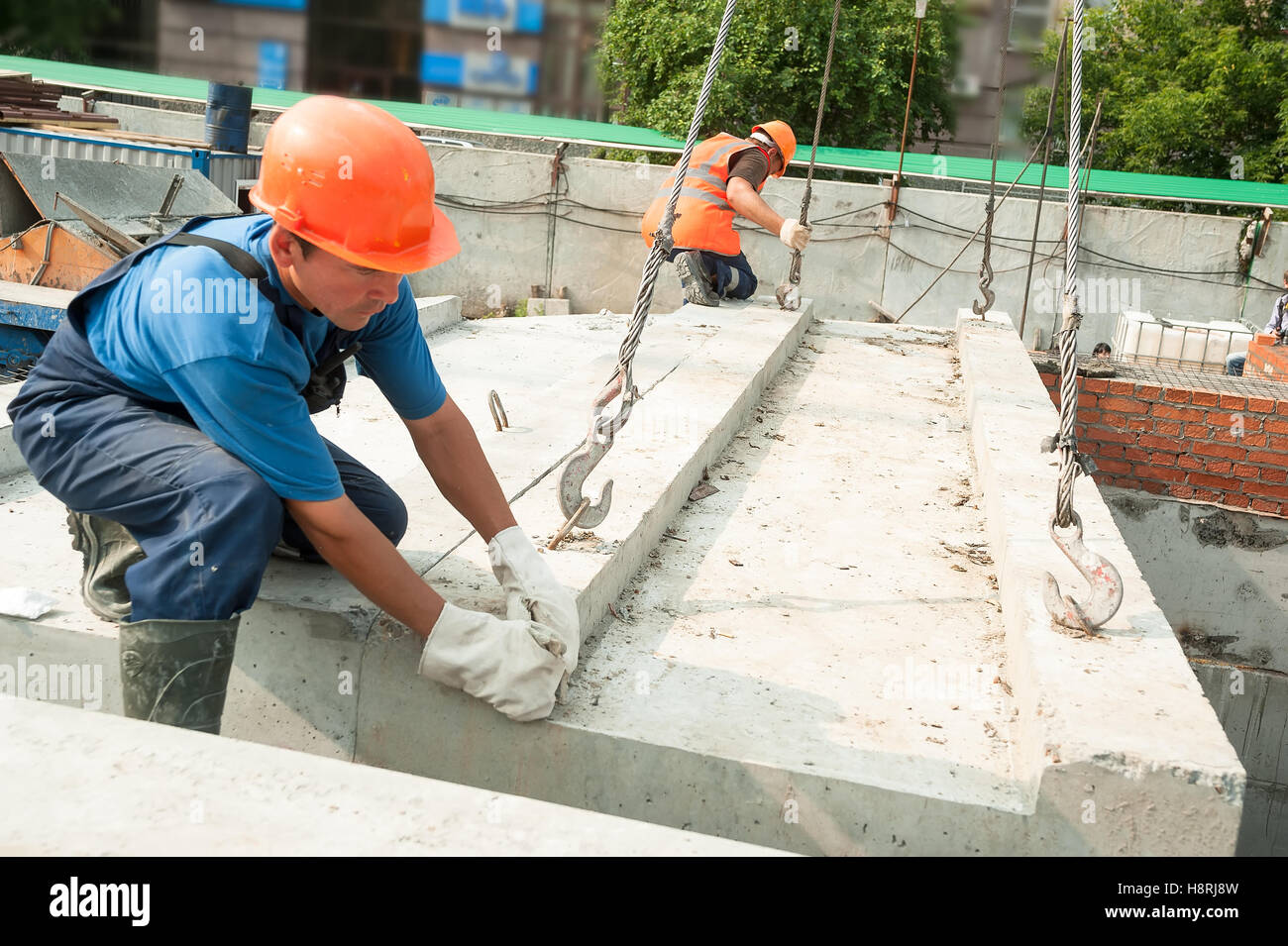 Builders working on residental house construction Stock Photo - Alamy