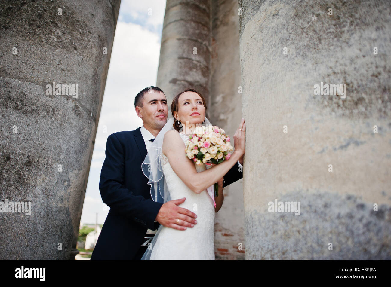 Wedding couple background old church with high columns Stock Photo - Alamy