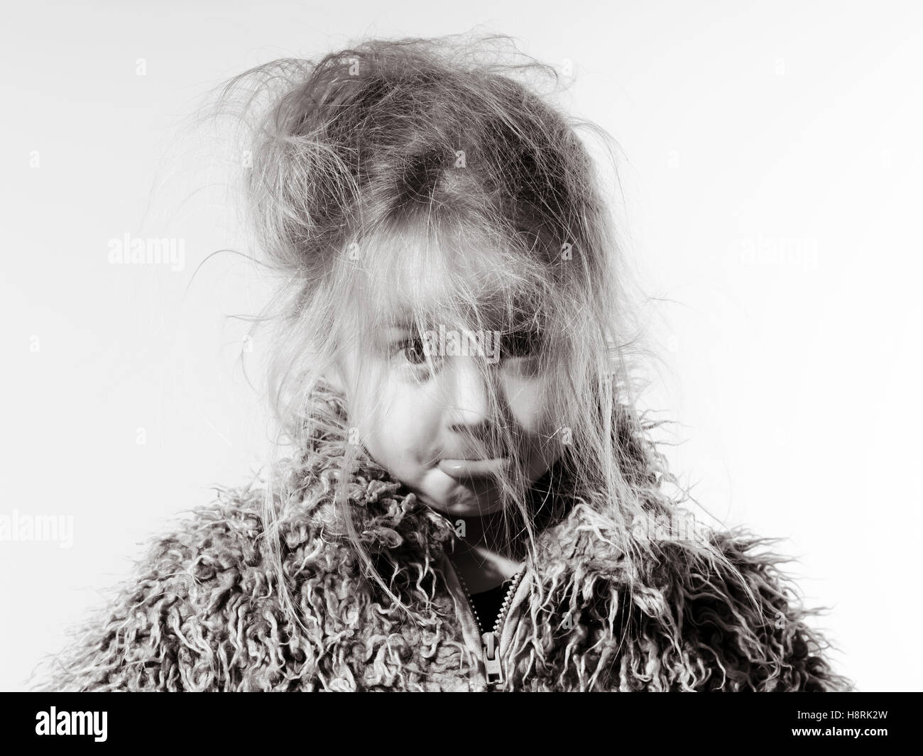 Surprised disheveled preschooler girl with long hair, isolated on white ...