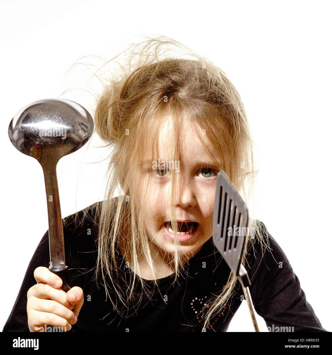 Disheveled preschooler girl with soup ladle, isolated on white ...