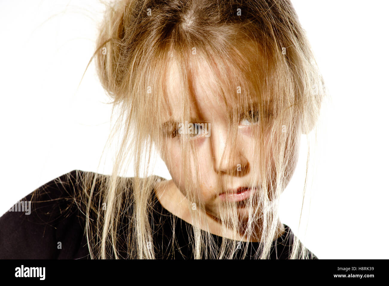 Disheveled preschooler girl with long hair portrait, isolated on white ...