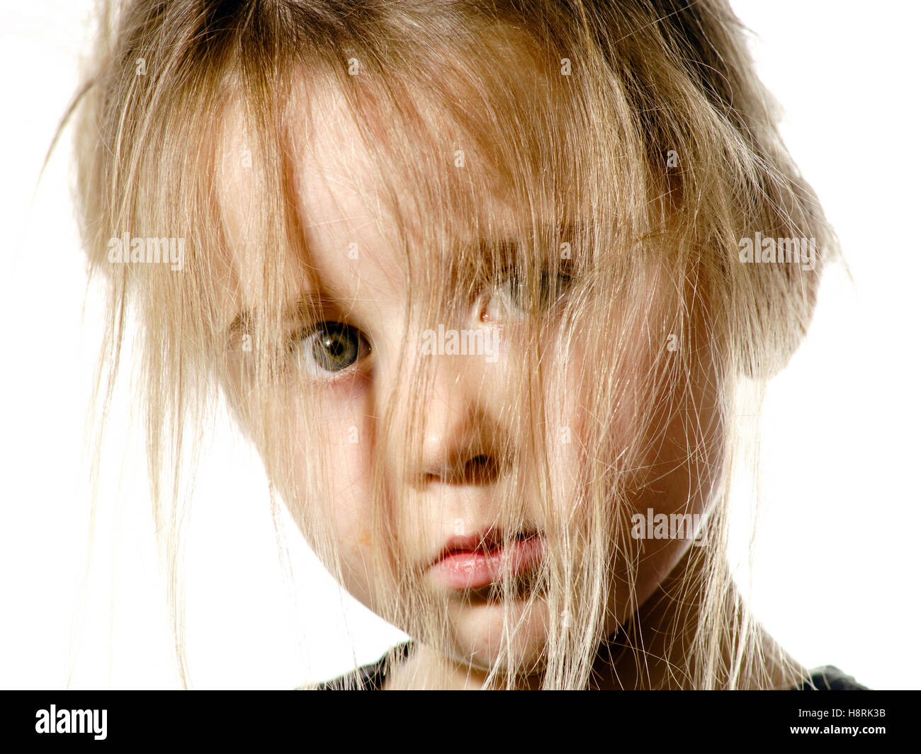 Disheveled preschooler girl with long hair portrait, isolated on white ...