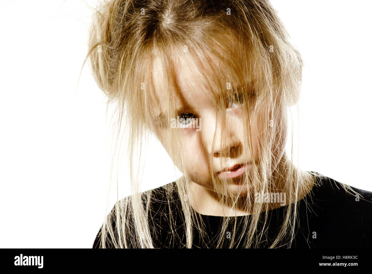 Disheveled preschooler girl with long hair portrait, isolated on white ...