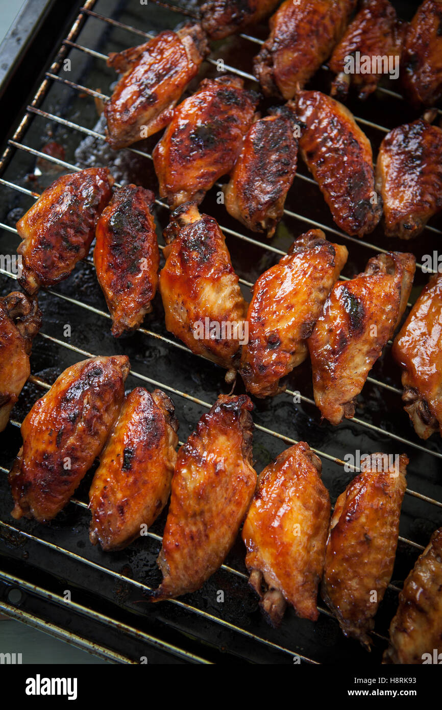 Hot bbq chicken wings on oven tray Stock Photo - Alamy