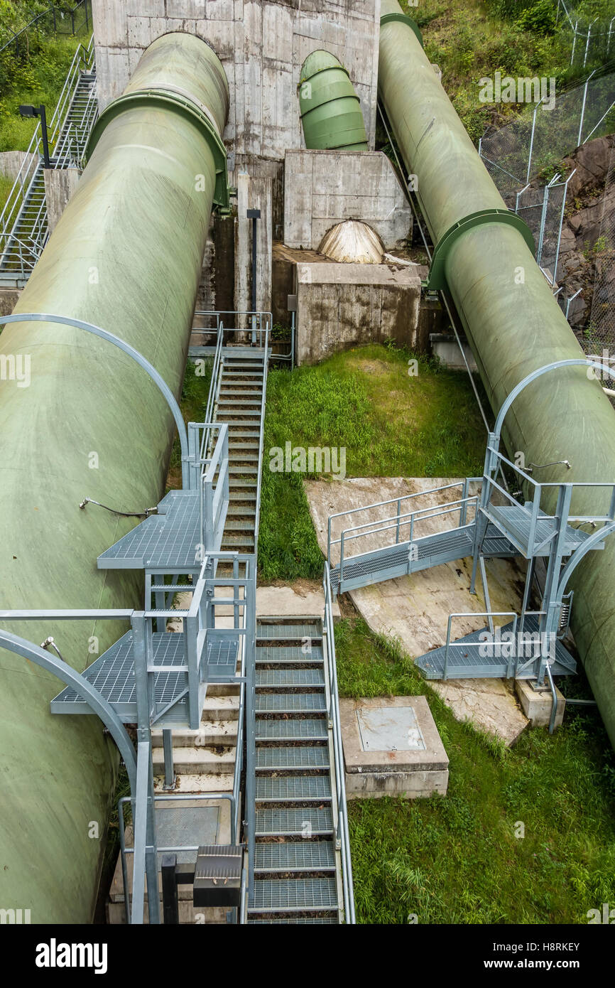 Large green pipes rise up Stock Photo - Alamy