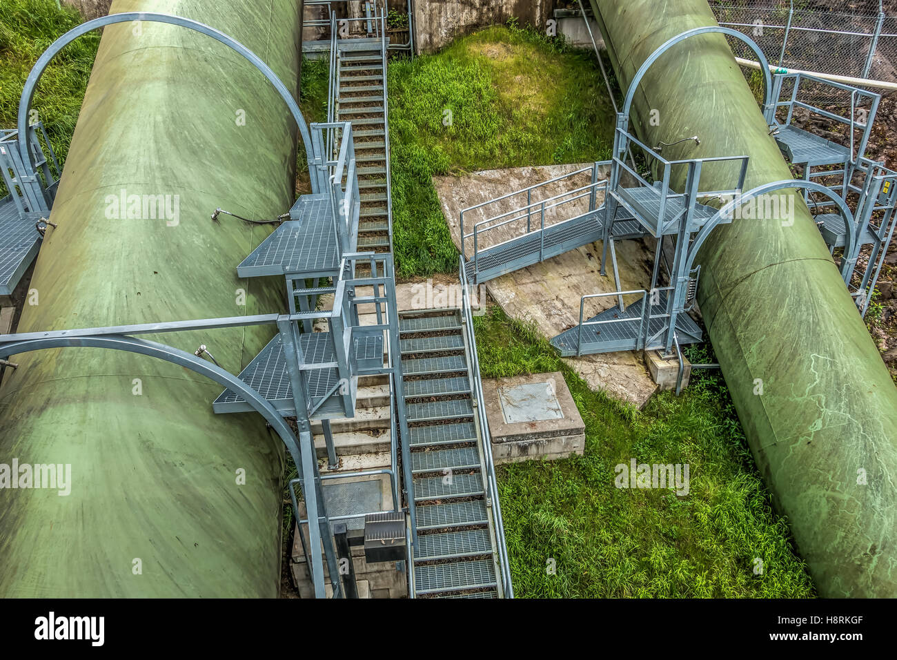 Large green pipes rise up. HDR image Stock Photo - Alamy