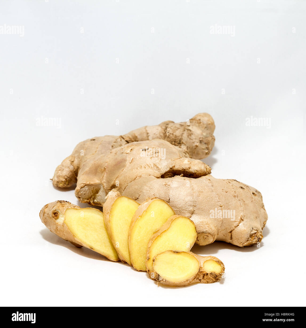 ginger root closeup on white background Stock Photo - Alamy