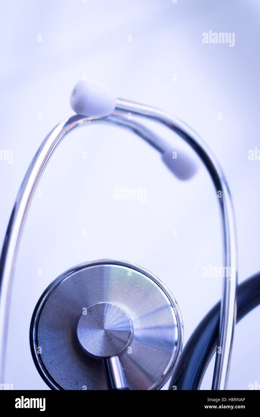 Medical doctor's stethoscope used to listen to patient heart rate ...