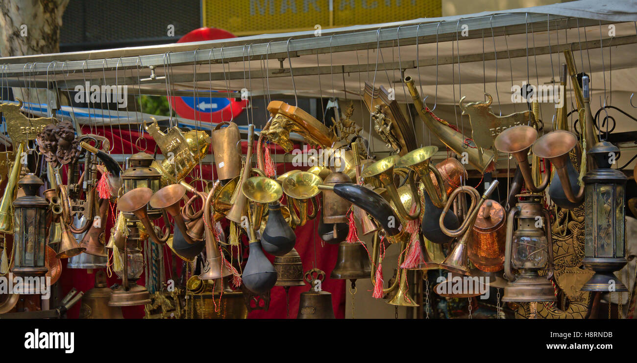 Copper wind instruments and lanterns hanging out on the El Rastro ...