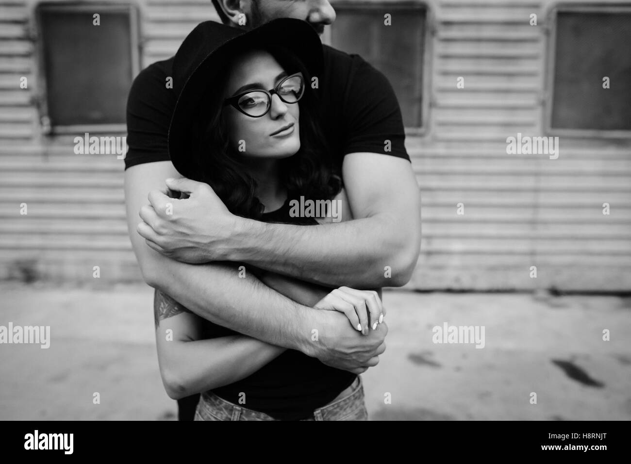 guy hugging his girlfriend from behind Stock Photo - Alamy