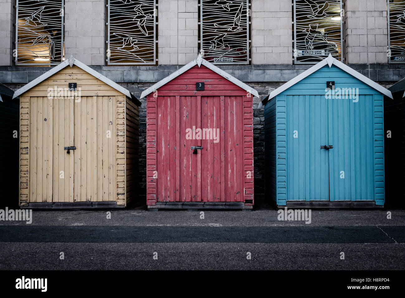 Three beach huts on the seafront in Boscombe, Dorset, England Stock ...