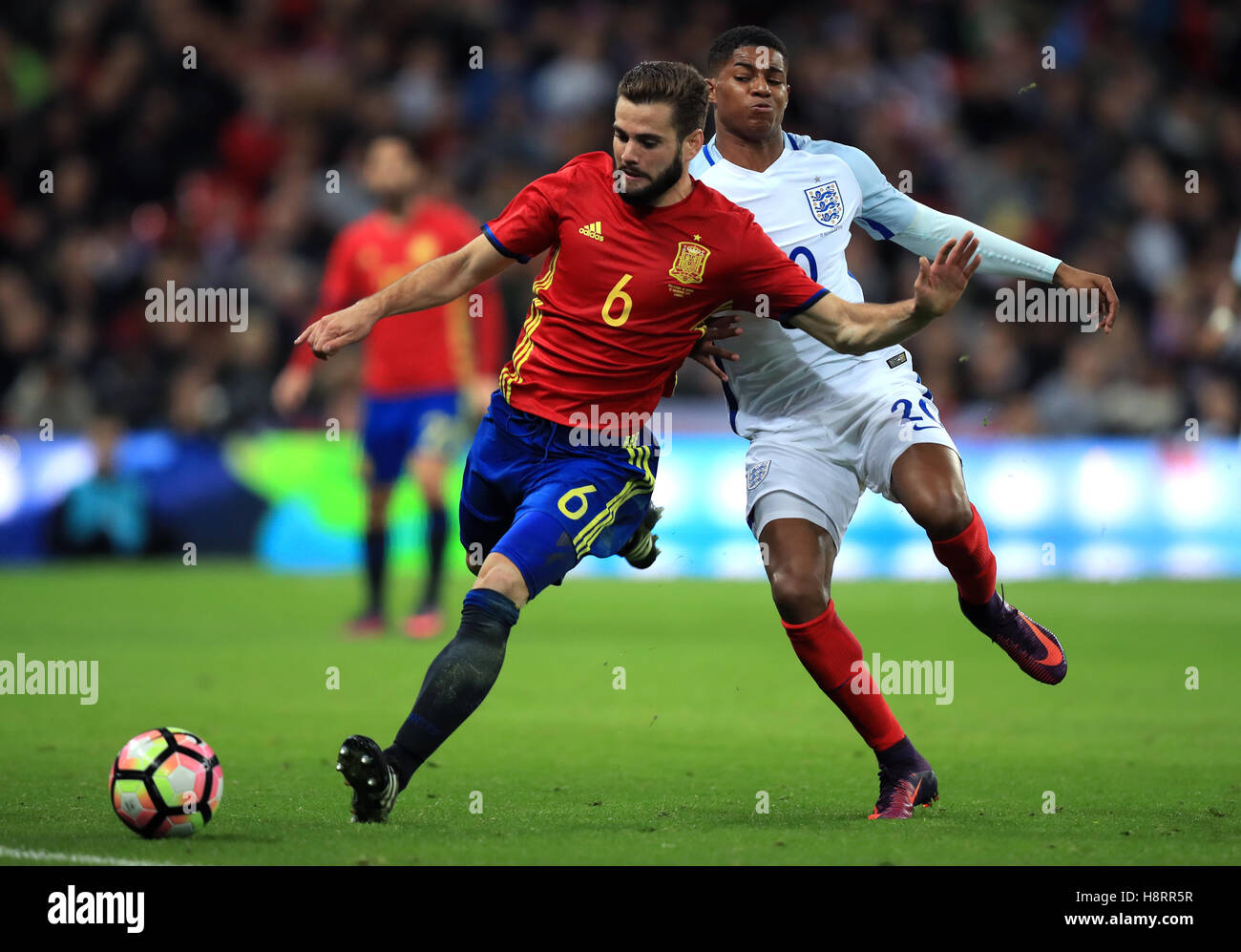 England's Marcus Rashford (right) and Spain's Fernandez Nacho battle ...