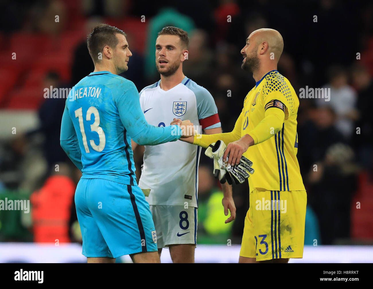 England's Tom Heaton and Jordan Henderson with Spain's Jose Reina after ...