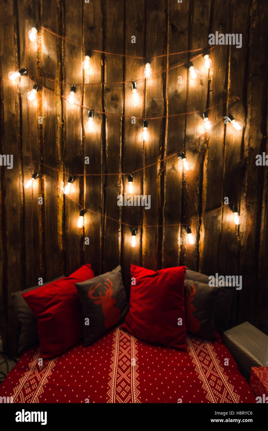 Wooden room in rustic house with wall and designer light bulbs ...