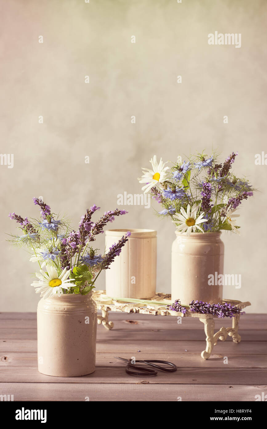 Spring flower arrangement in vintage ceramic pots Stock Photo - Alamy