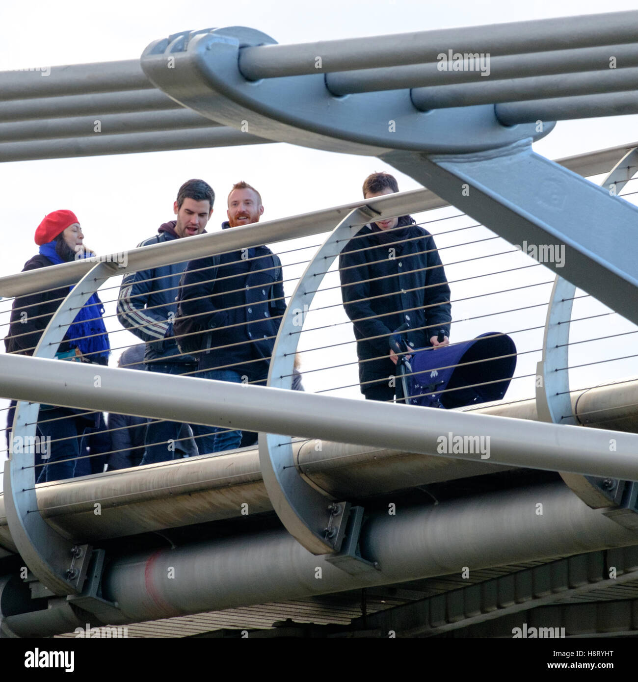 People crossing The Millenium Bridge over the Thames, London,United ...