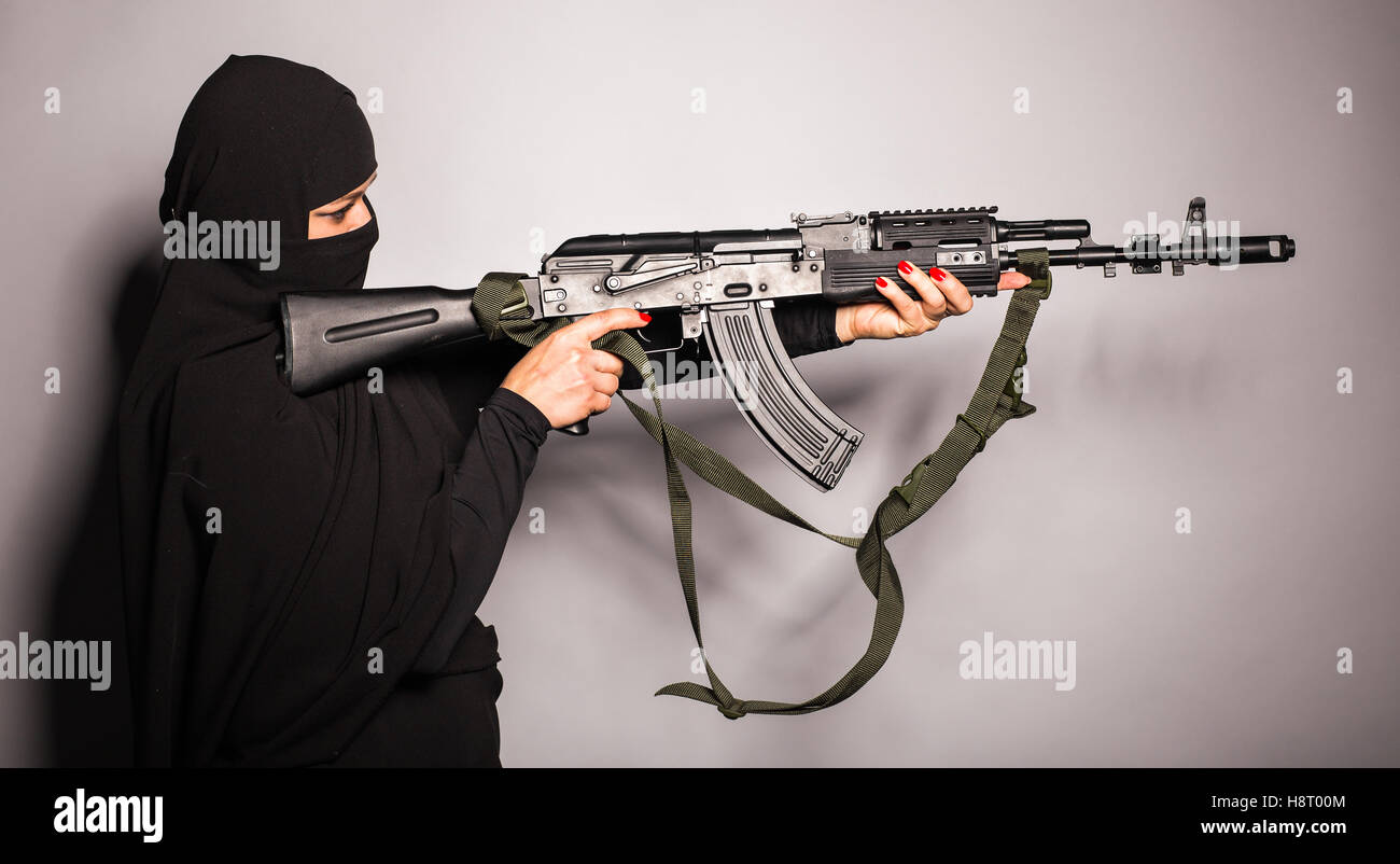 Muslim woman with machine gun. Armed female warriors of Islam ...