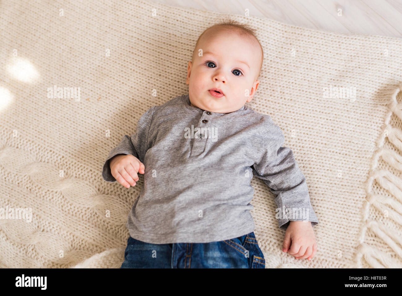 Baby Boy lying on a back Stock Photo - Alamy