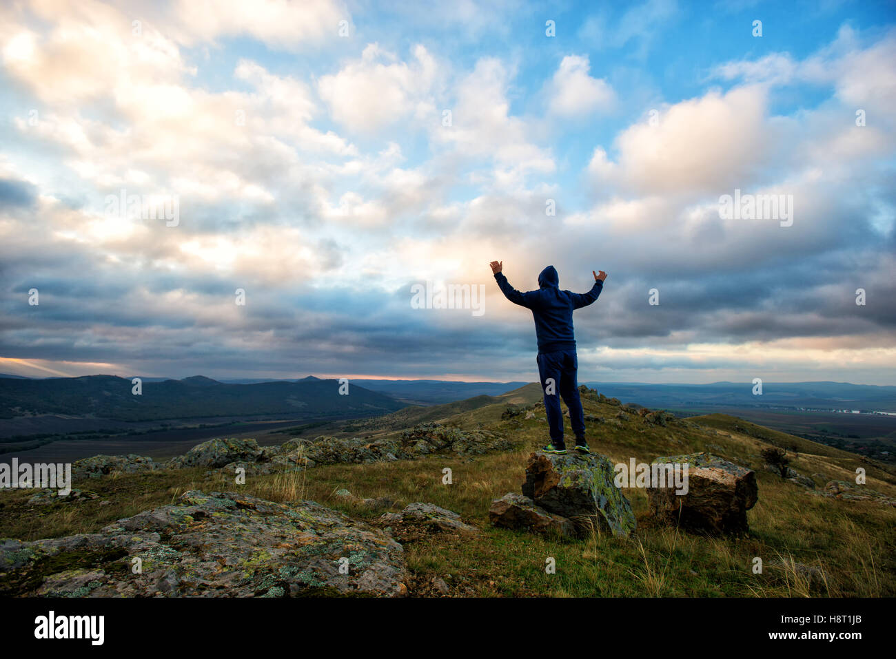 Man on a hill Stock Photo - Alamy