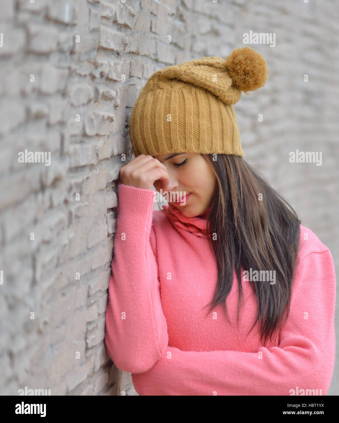 Close-up of a sad and depressed woman deep in thought outdoors with ...