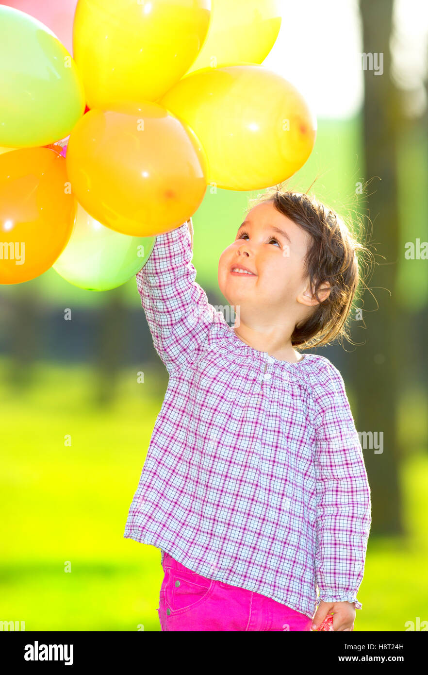 happy girl with colorful balloons Stock Photo - Alamy