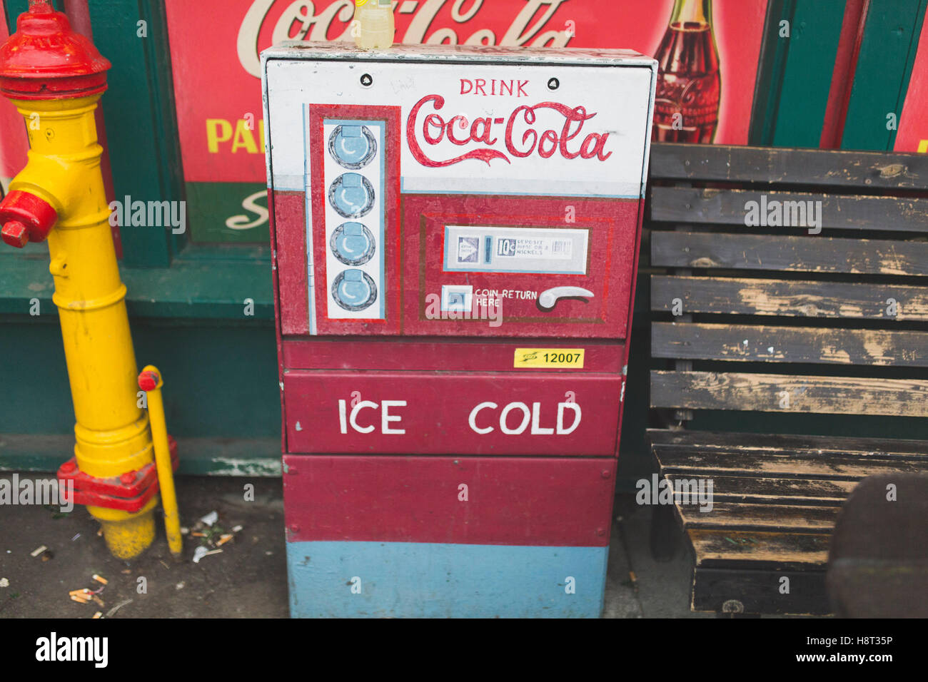 Coca-Cola branding painted on electricity box outside corner shop in ...