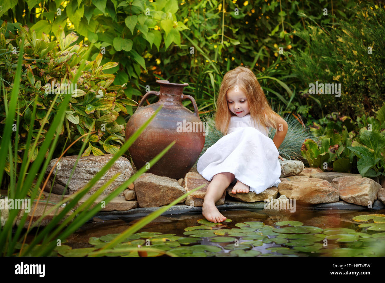 Portrait of a young woman outdoors with vintage sign hi-res stock ...