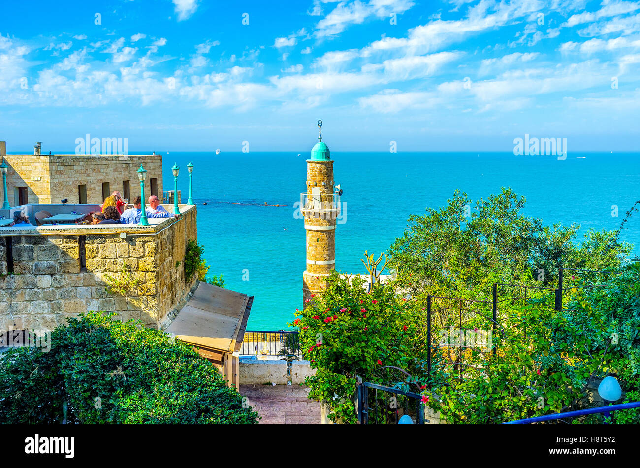 The tourists on the restaurant's roof enjoy the seaside and the ...